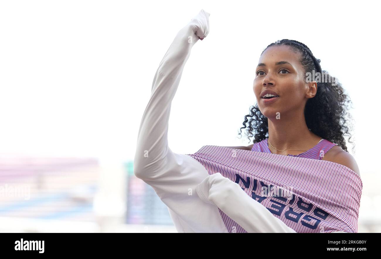 Great Britain's Morgan Lake talks to her coach between between jumps as ...