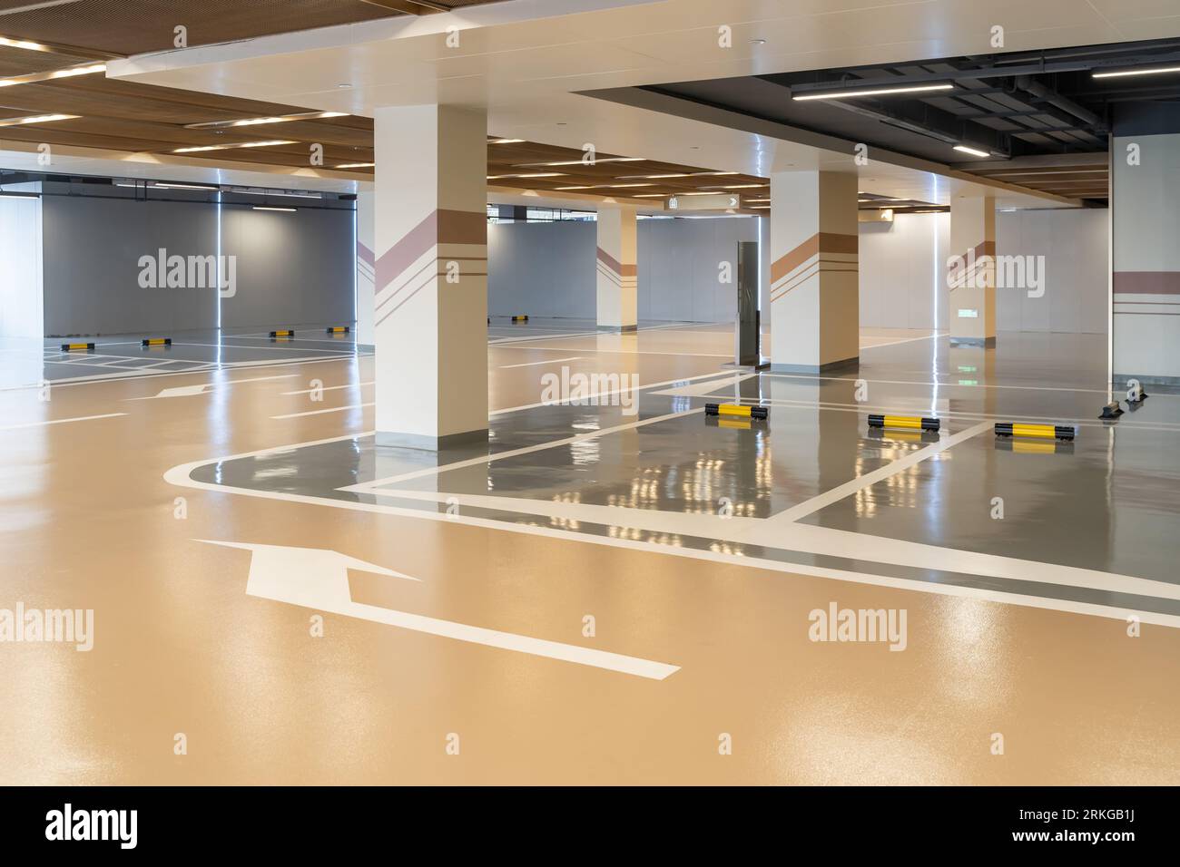 Empty public underground parking lot or garage interior with concrete ...