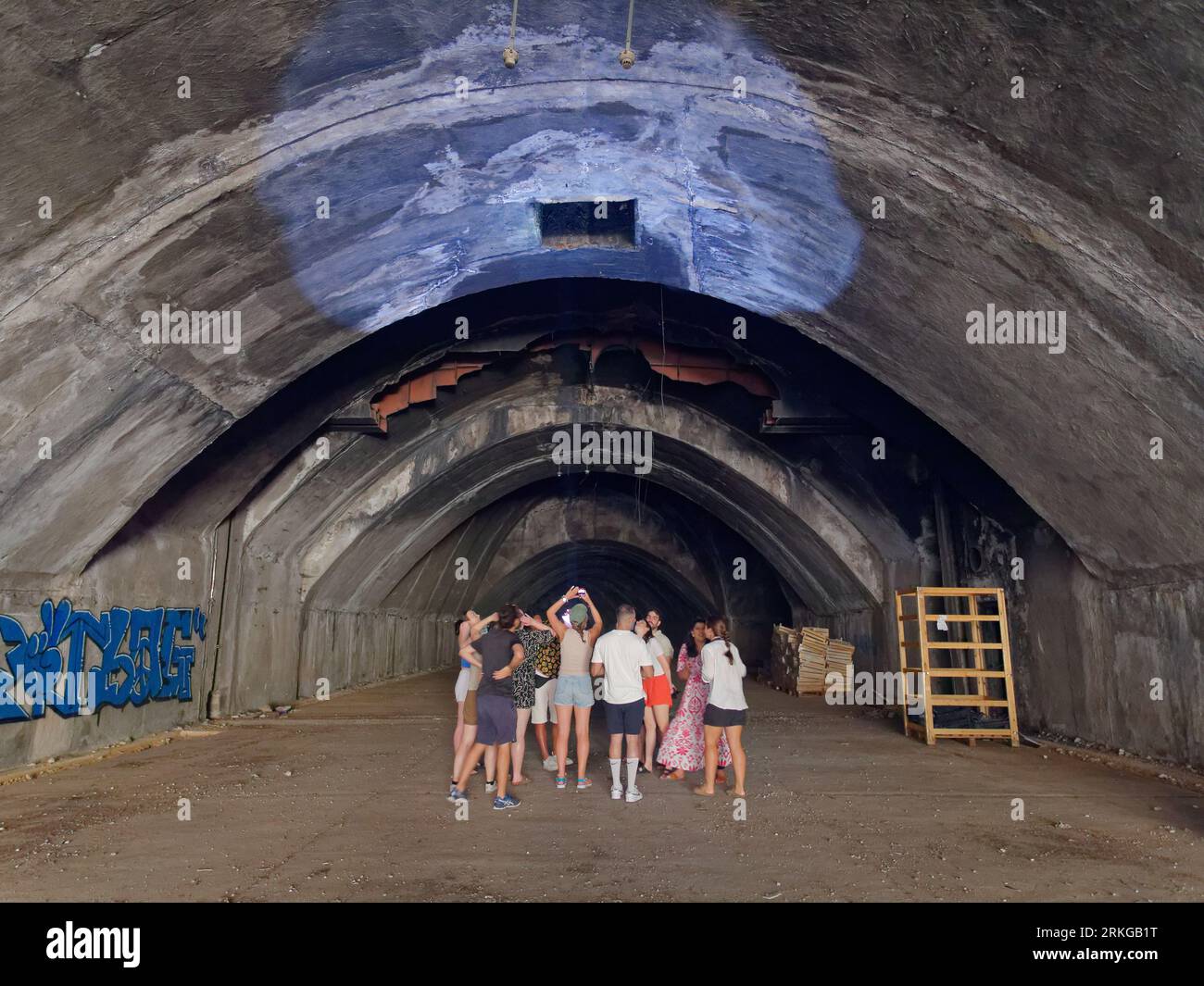 Tour group explore an old secret underground bunker used by Yugoslav ...