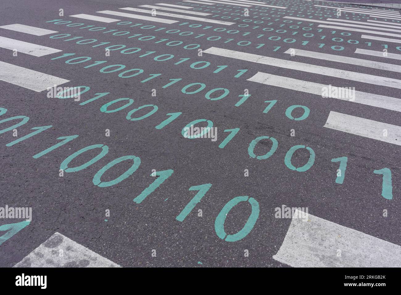 Binary code painted on a pedestrian crossing Stock Photo - Alamy