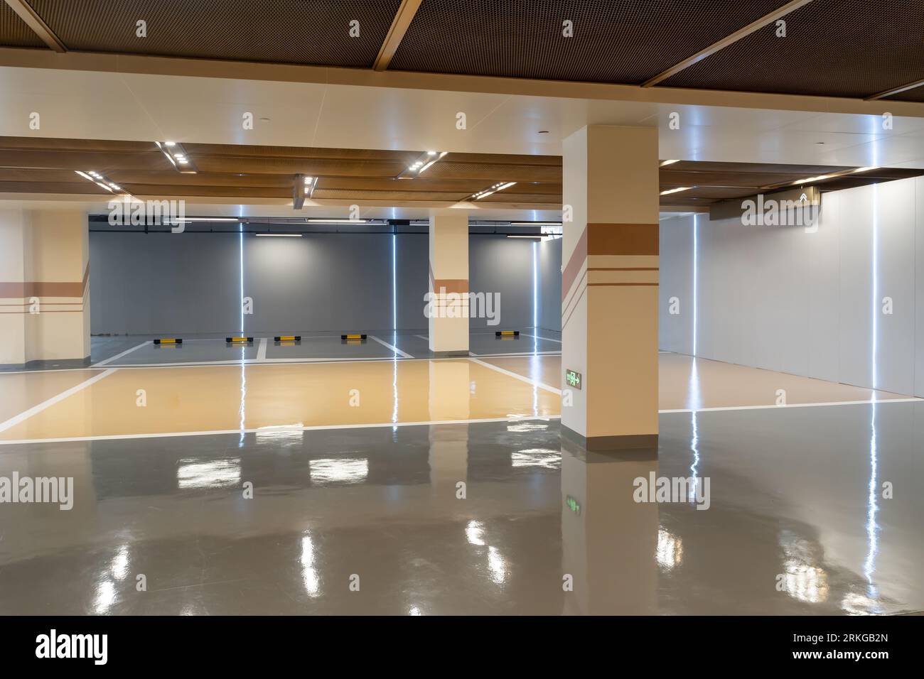 Empty public underground parking lot or garage interior with concrete ...
