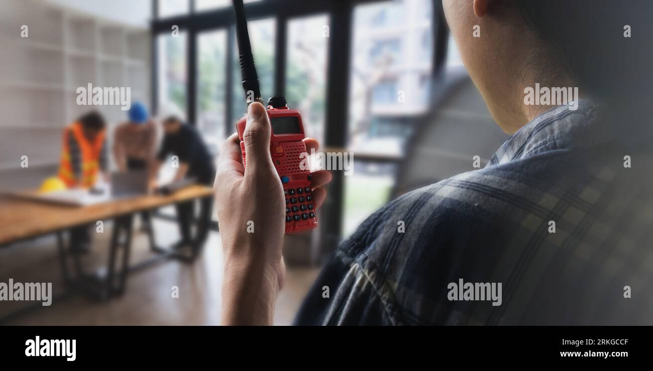 Asian male supervisor engineer standing at construction site and ...