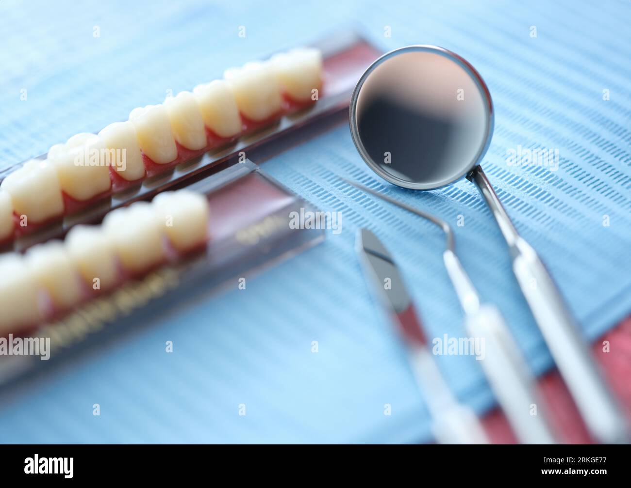 Set of dentures and dental instruments. closeup Stock Photo - Alamy