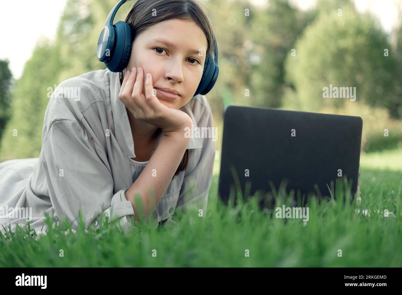 Teenage schoolgirl studying reading her books, tablet and notebook ...