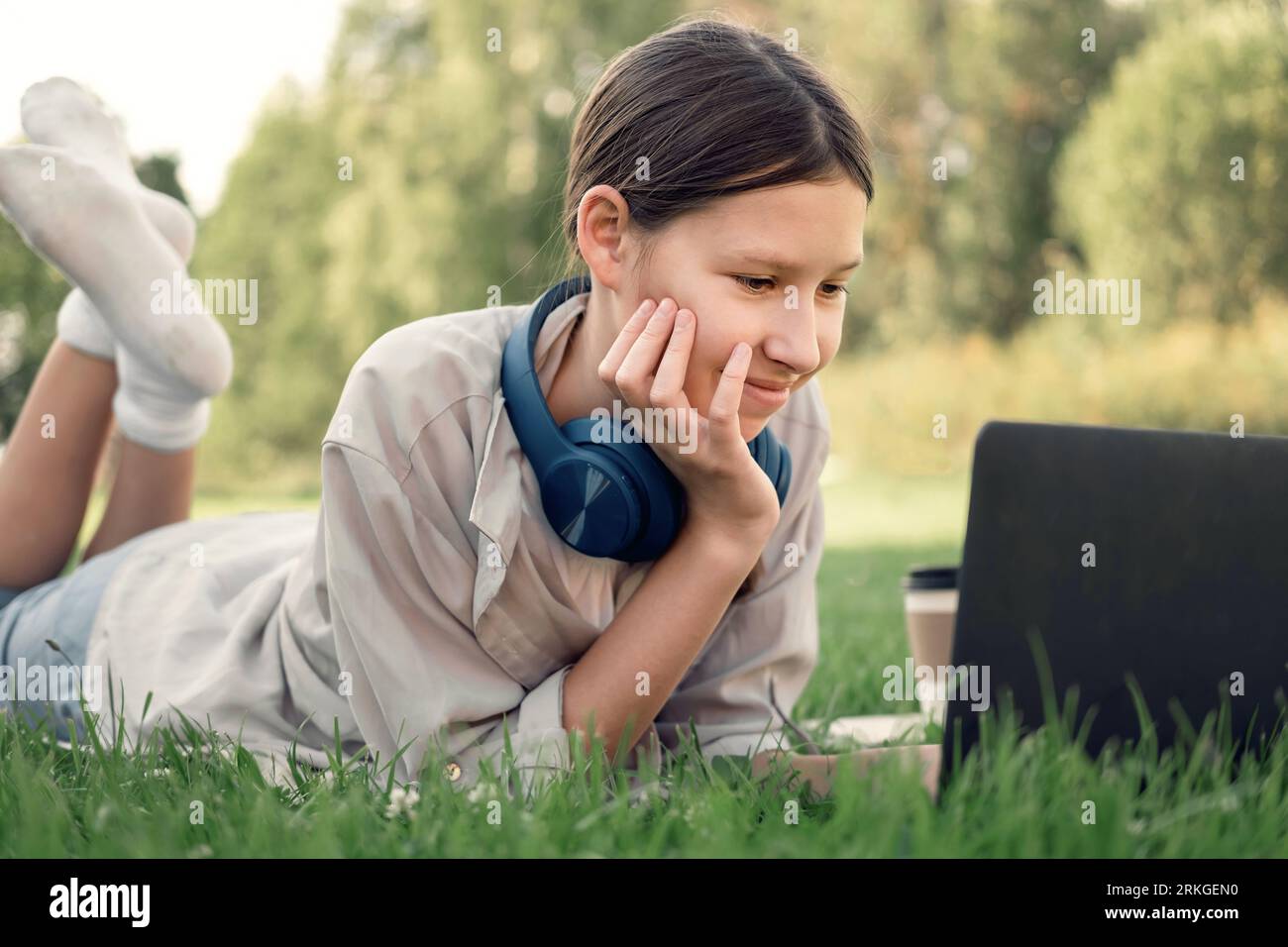 Teenage schoolgirl studying reading her books, tablet and notebook ...