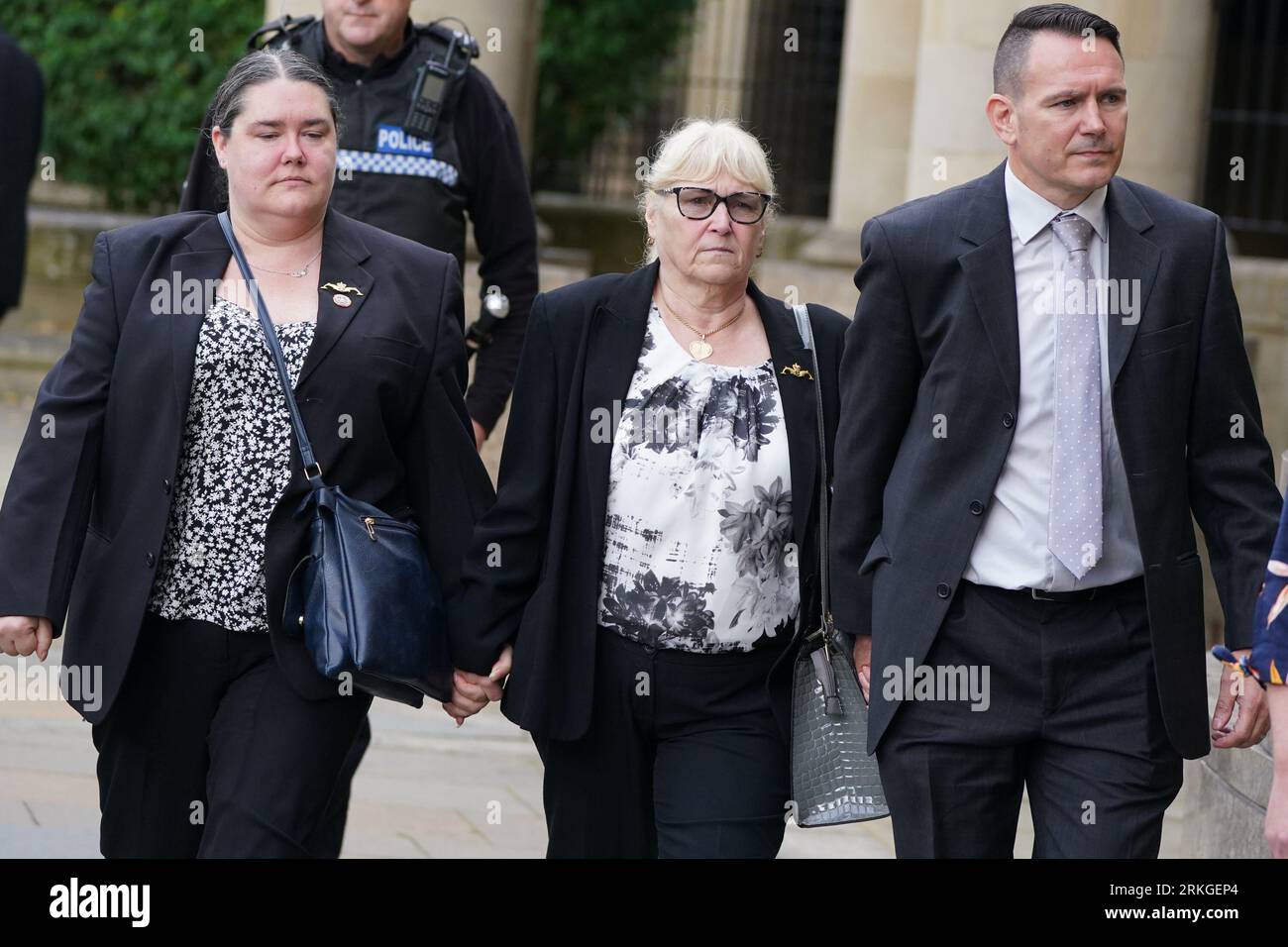 The widow of Tony Parsons, Margaret Parsons (centre) leaves the High ...