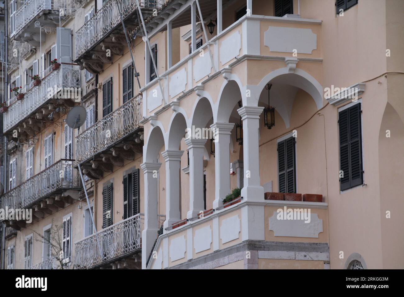 A bustling urban scene of high-rises with balconies overlooking a busy ...