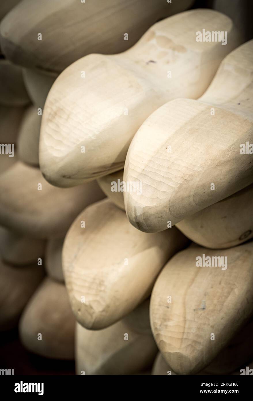 A vertical of a stack of traditional Dutch wooden clogs Stock Photo - Alamy