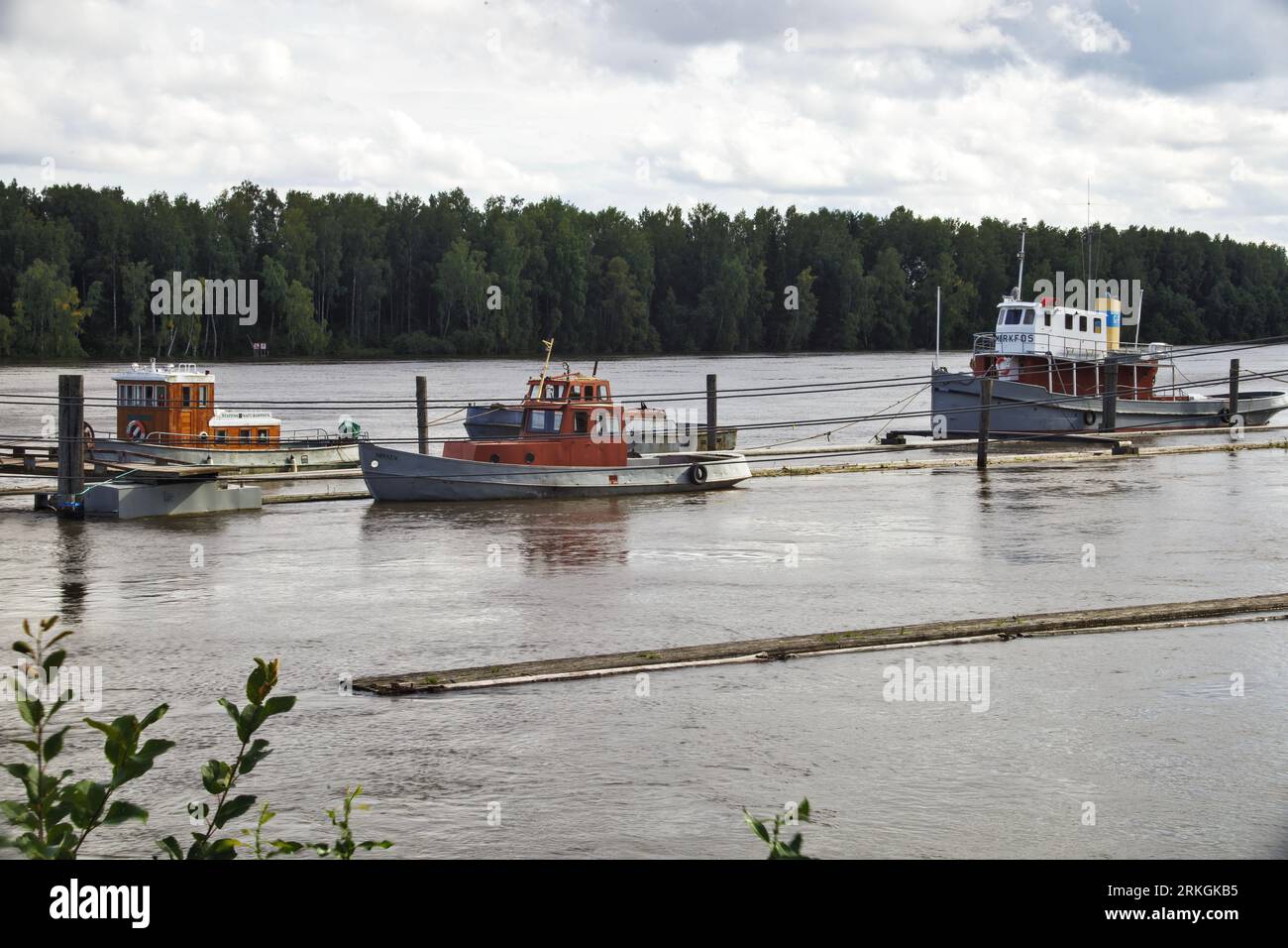 The several small boats docked at a harbor in Fetsund, Norway Stock ...