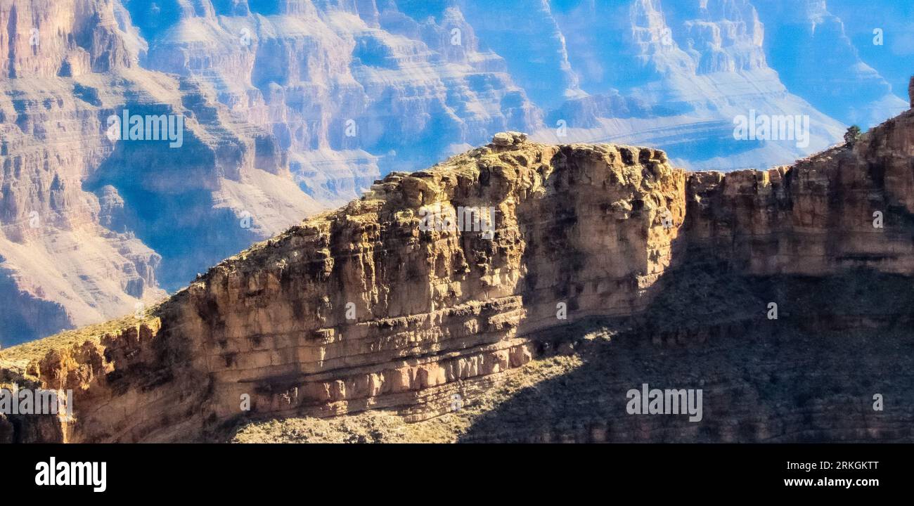 A majestic mountain cliff with an impressive steep curve overlooking ...