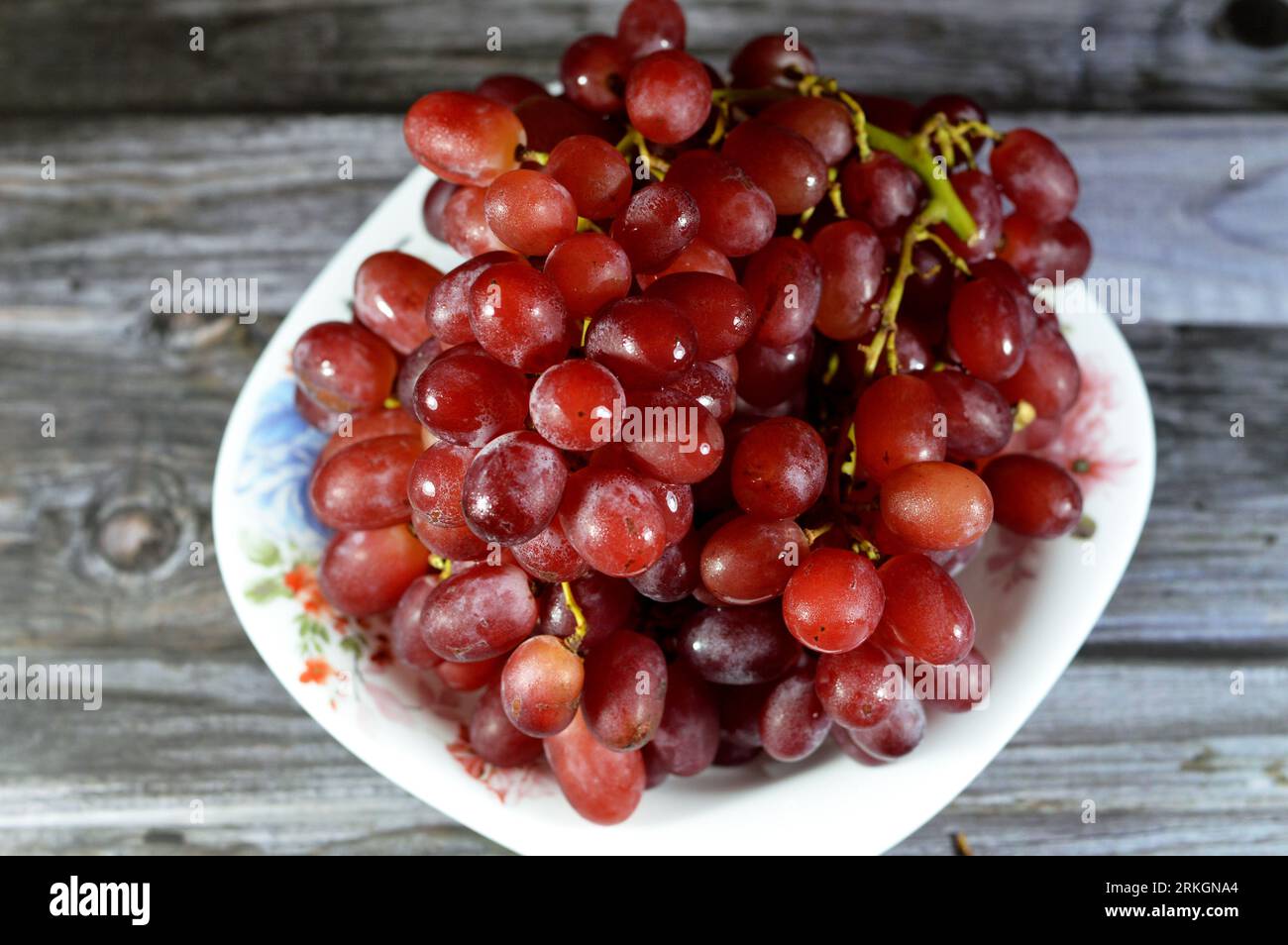 Red grapes, a fruit, botanically a berry of the deciduous woody vines ...