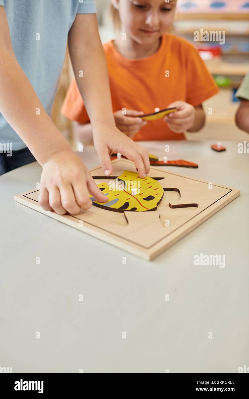interracial kids playing with didactic montessori material in school ...