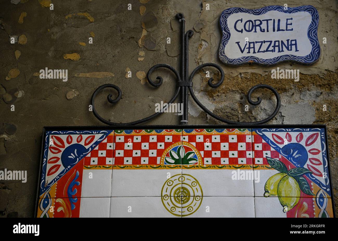 Antique handcrafted ceramic tile sign indicating Cortile Vazzana a ...