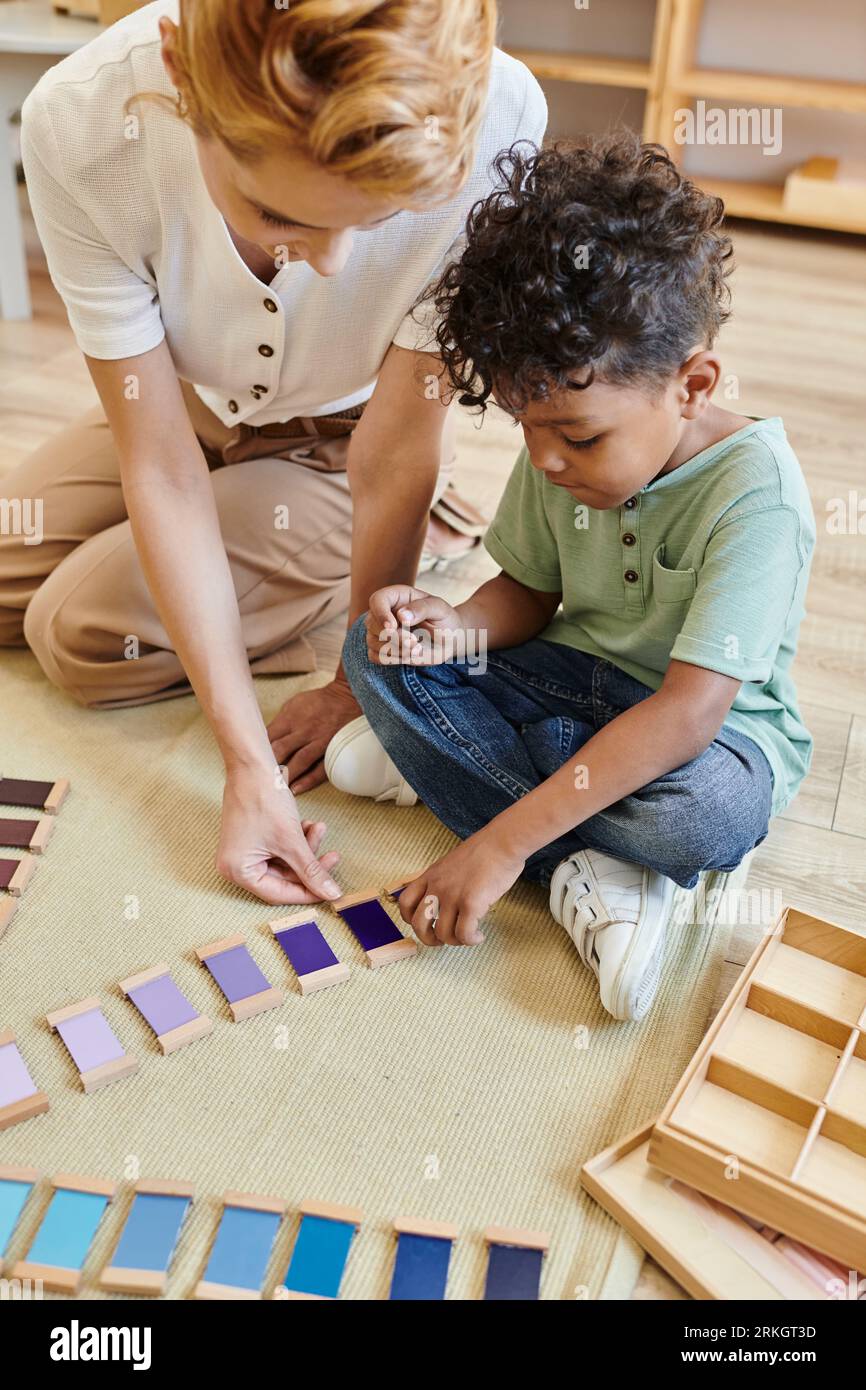 montessori color box, material touch box, blonde woman and african ...