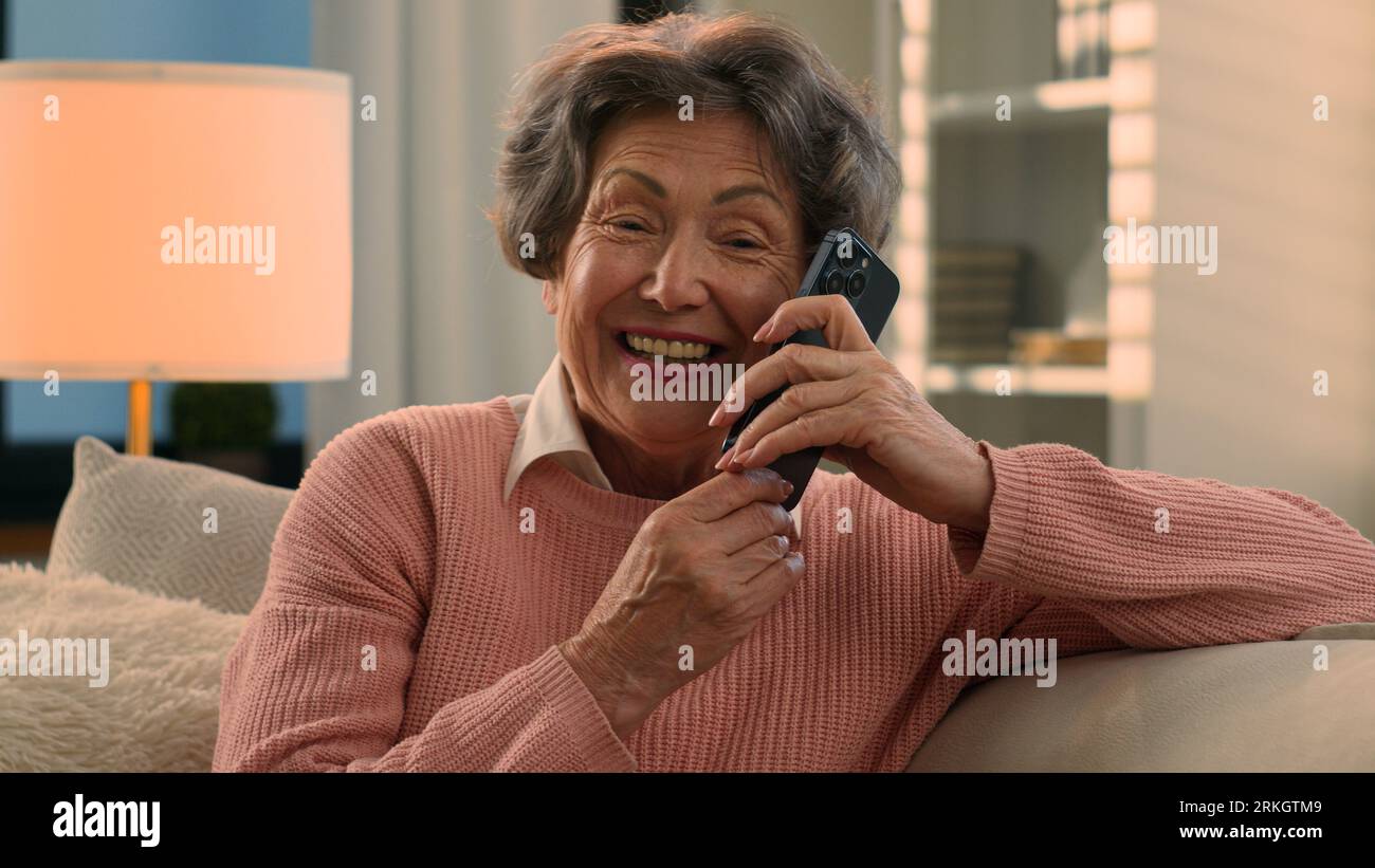 Happy laughing talking phone Caucasian old woman carefree senior lady ...