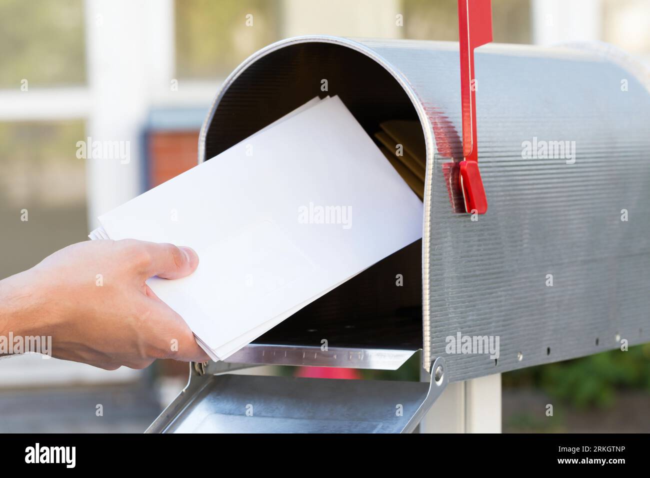 Putting letters in mailbox hi-res stock photography and images - Alamy