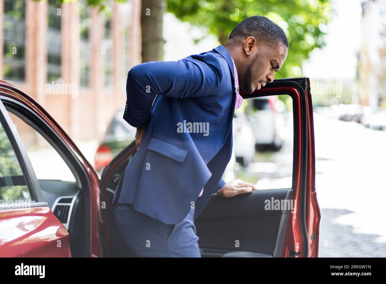Car Driving Pain Back Injury. Bad Posture Stock Photo - Alamy