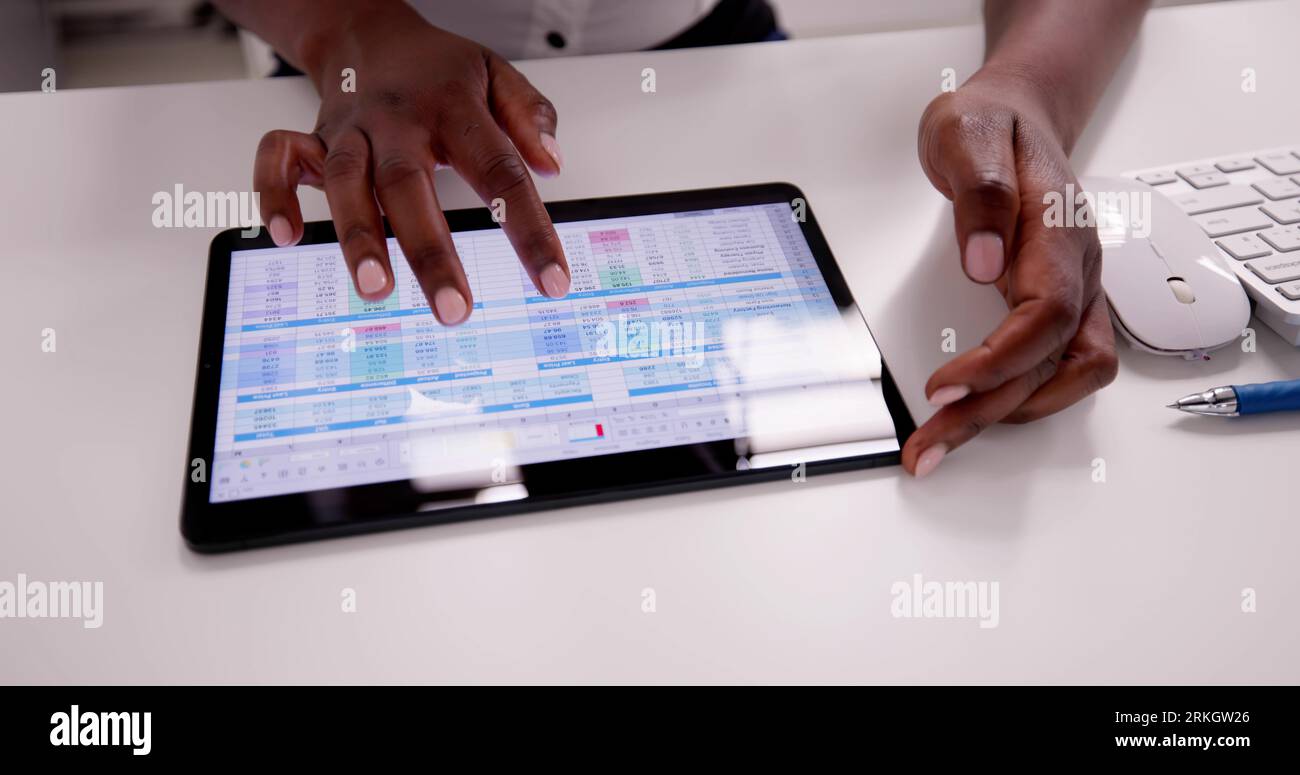 African American Spreadsheet Data Analyst Using Computer Software Stock ...