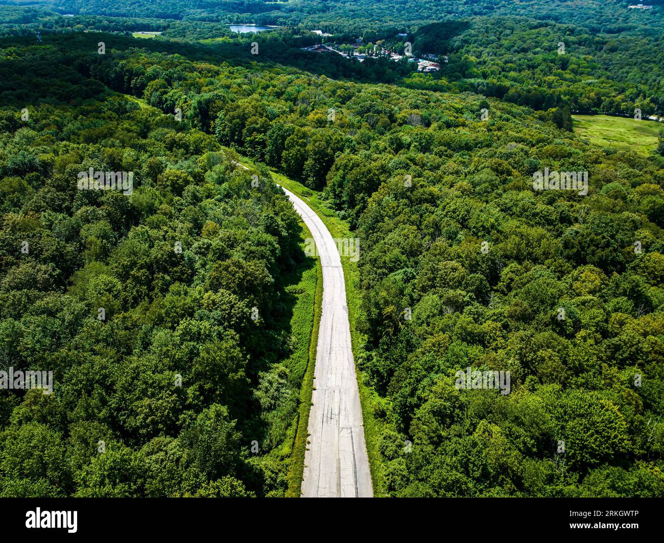 An aerial view of a road in a green lush landscape Stock Photo - Alamy