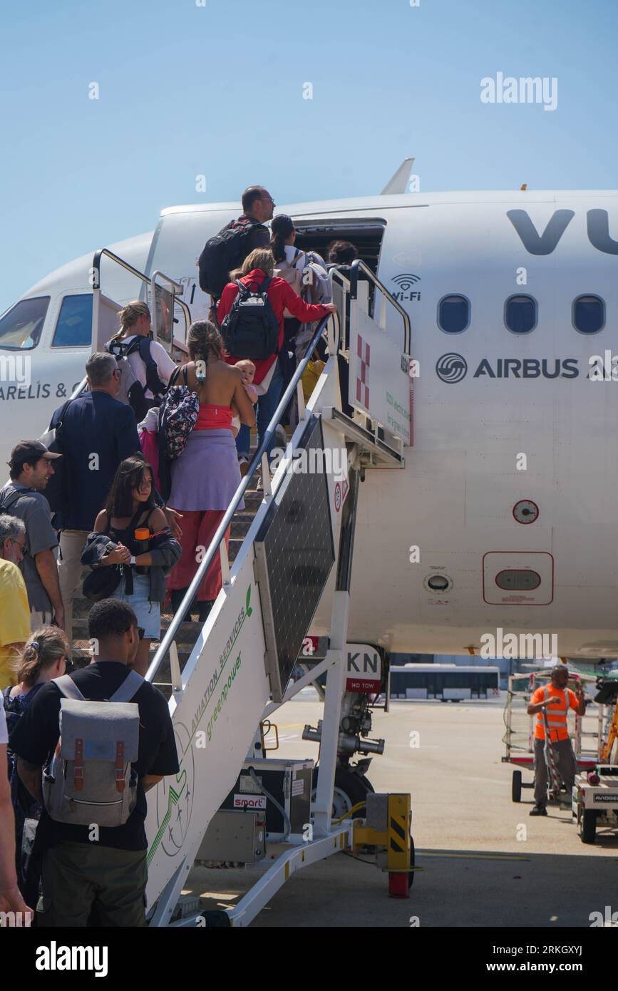 Rome Fiumicino, Italy. 25 August 2023 . Passengers boarding A Vueling ...