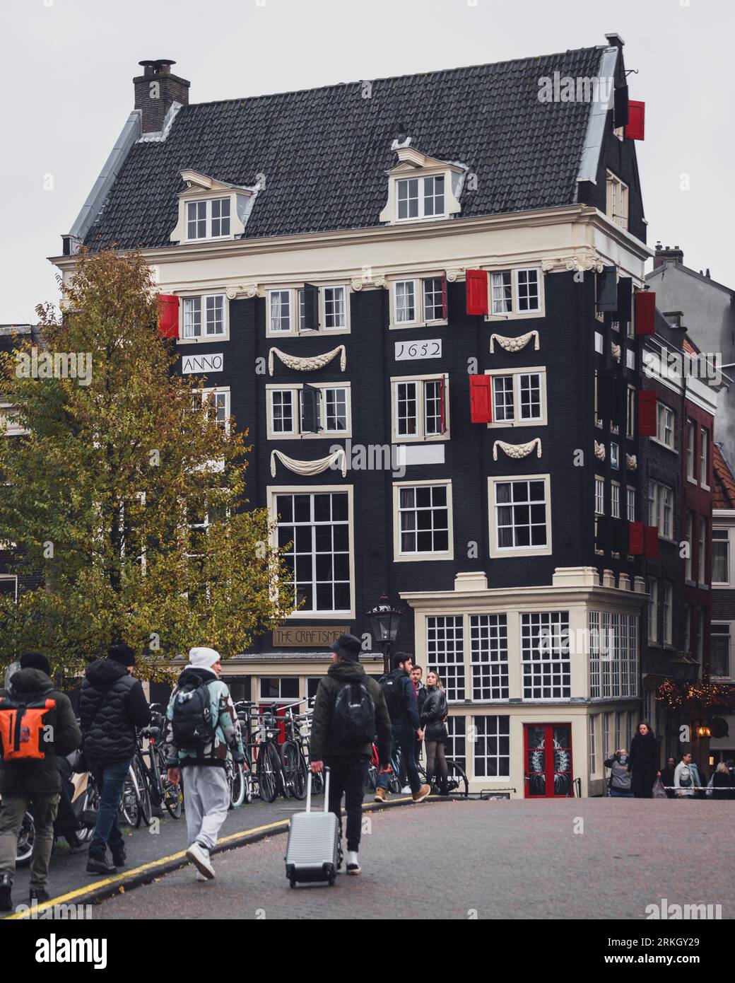 Amsterdam, Netherlands - November 28 2022: People cross a bridge in ...