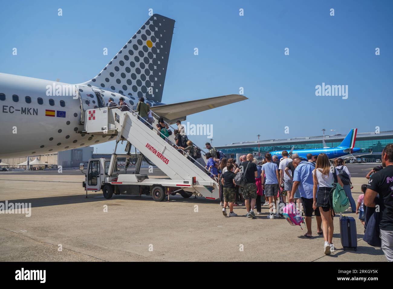 Rome Fiumicino, Italy. 25 August 2023 . Passengers boarding A Vueling ...
