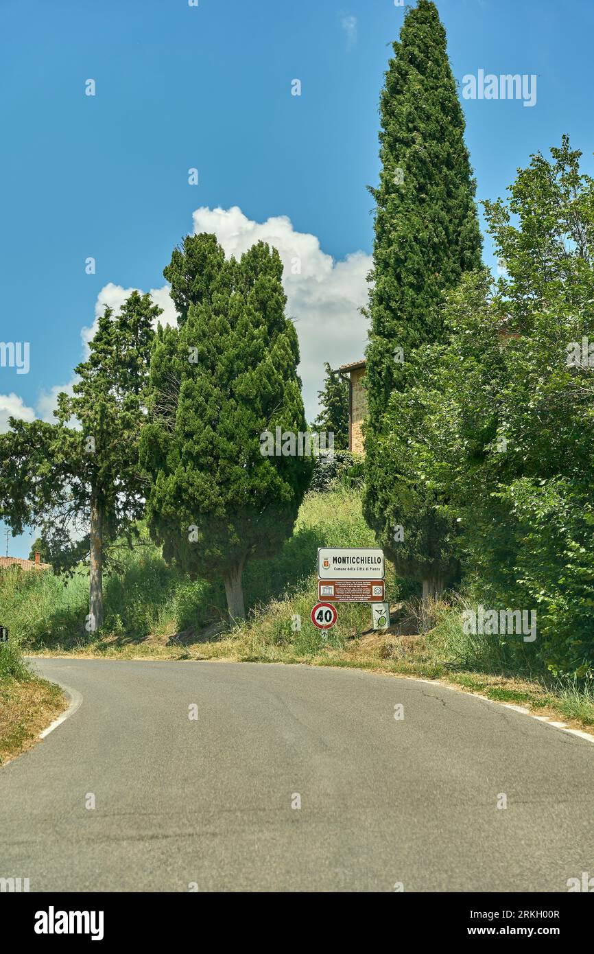 A scenic country road with multiple signs indicating directions for ...
