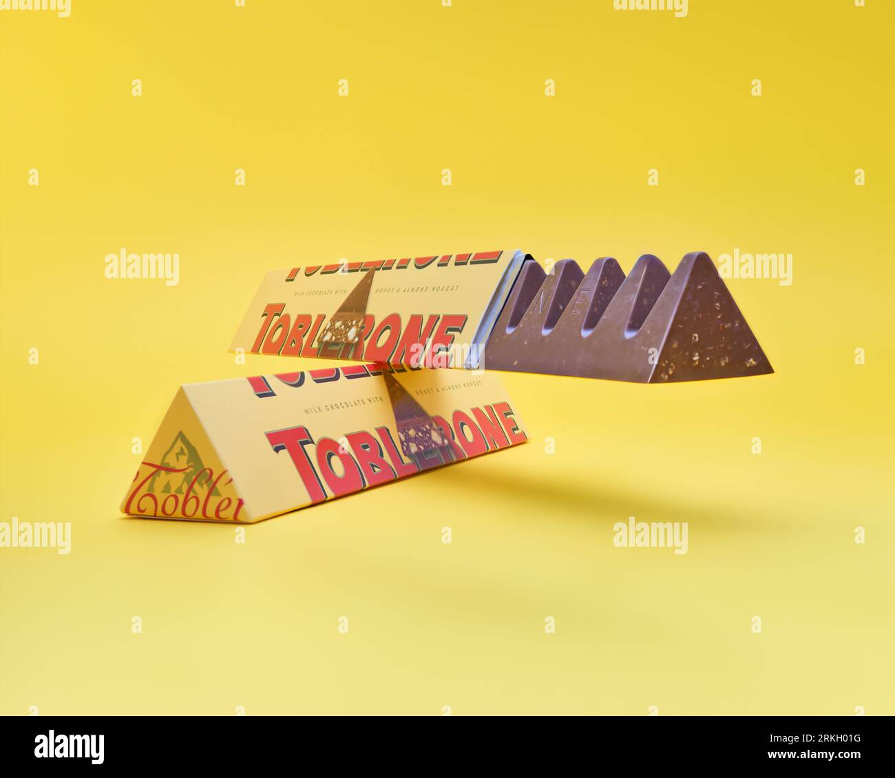 A yellow background with a Toblerone chocolate bar visible, its iconic ...