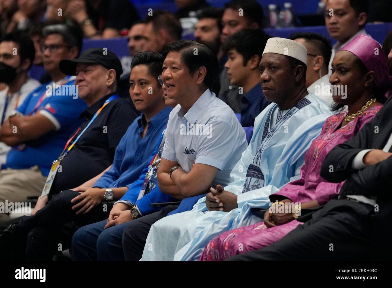 Philippine President Ferdinand Marcos Jr., center, watches the game ...