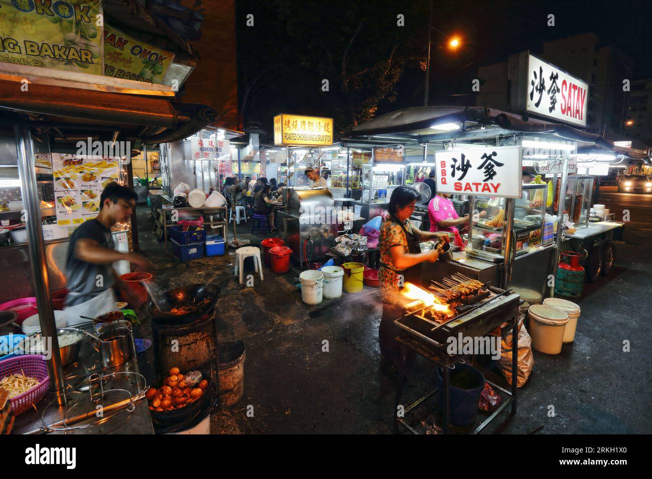 A vibrant traditional food market at night in George Town, Malaysia ...
