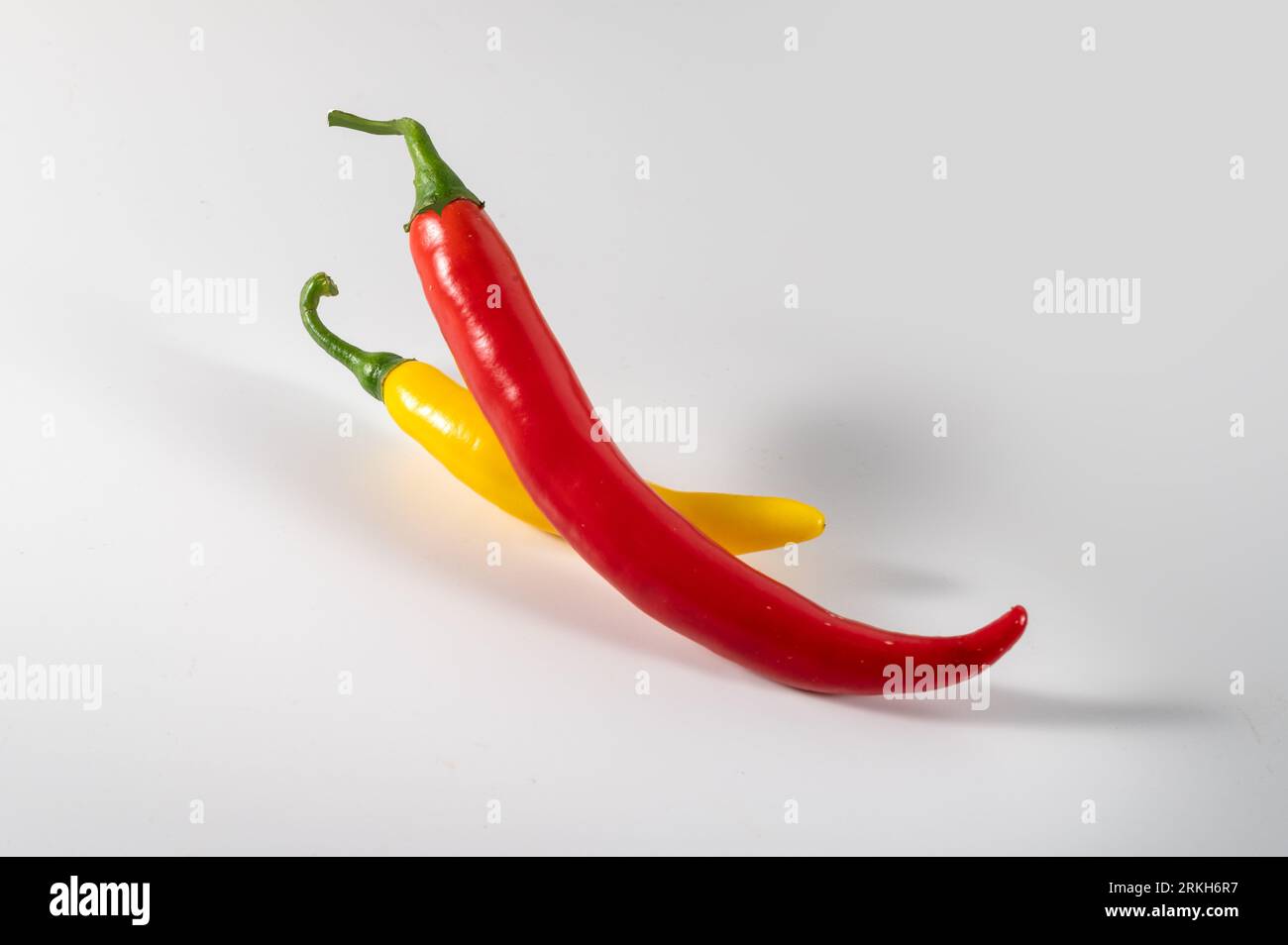 Chili peppers in 3 colours on white isolated Stock Photo - Alamy
