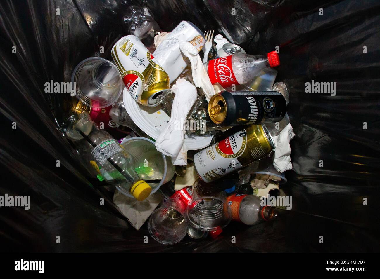 This stock photo depicts an overhead view of a trash can filled with ...