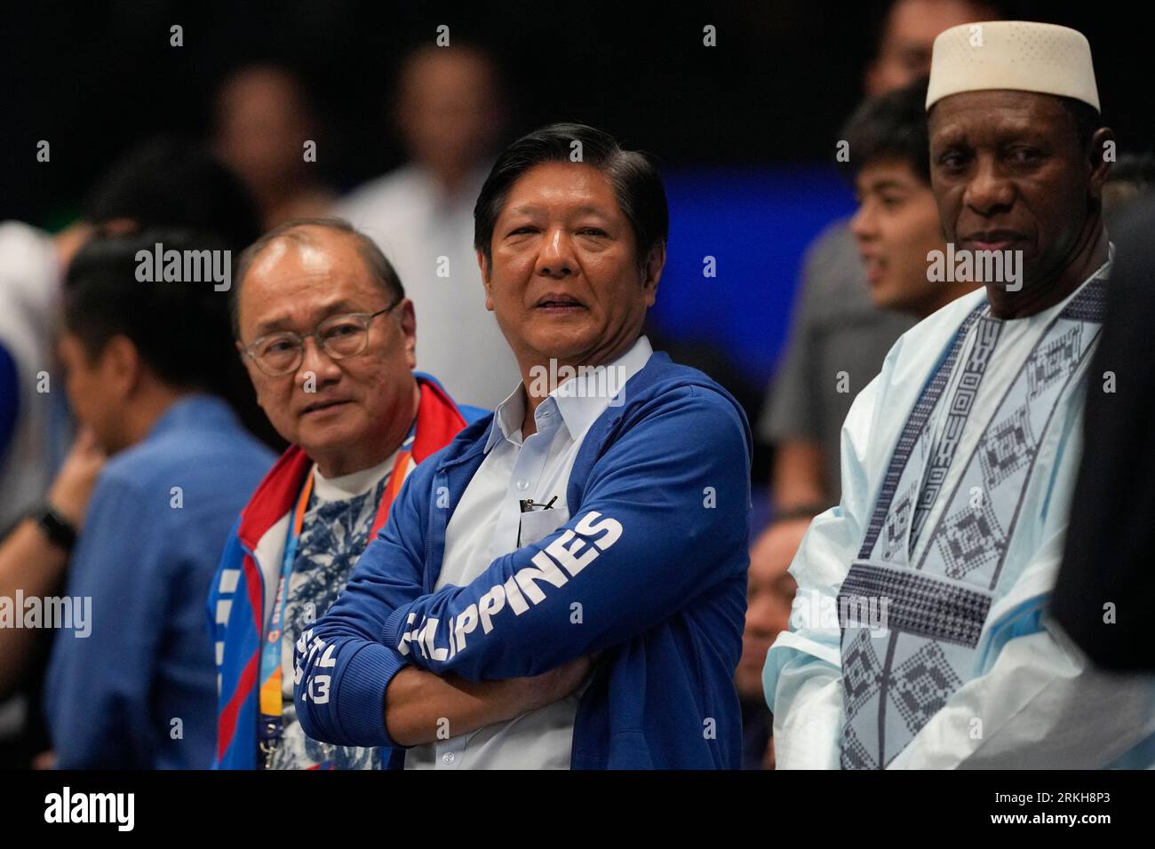 Philippine President Ferdinand Marcos Jr., center, watches the game ...