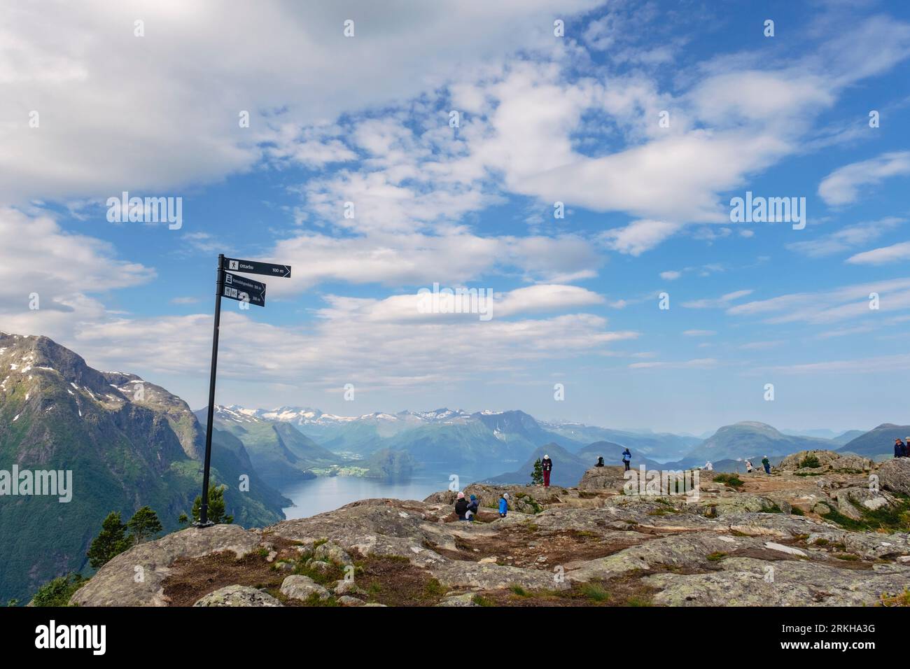 People walking on Nesaksla mountain with a view to Romsdalsfjorden ...