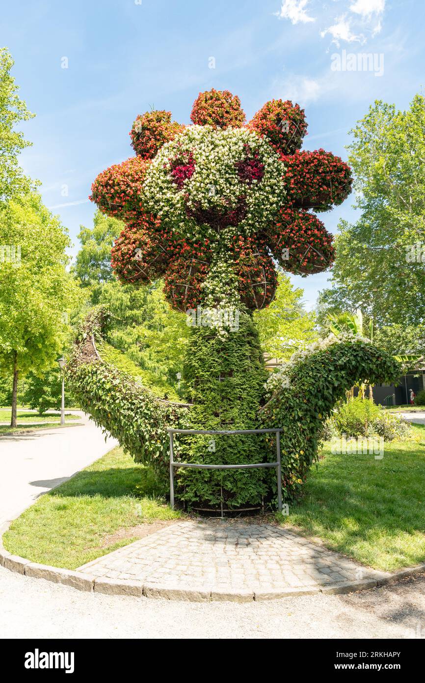 Mainau, Germany, July 20, 2023 Sun flower figure with a smiling face ...