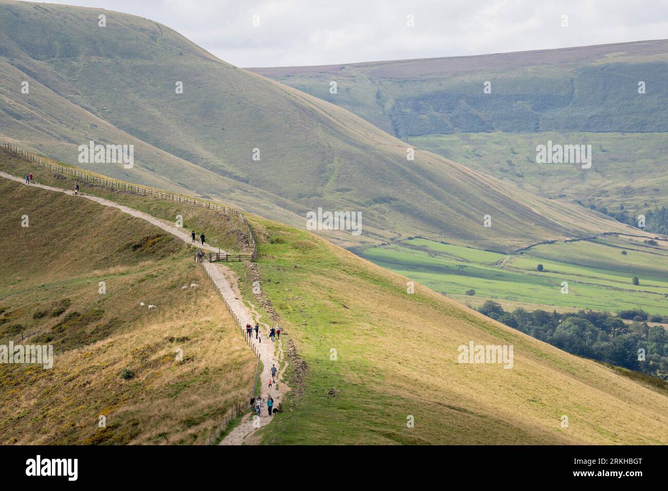 Family walkers and long-distance hikers take the footpath along the ...