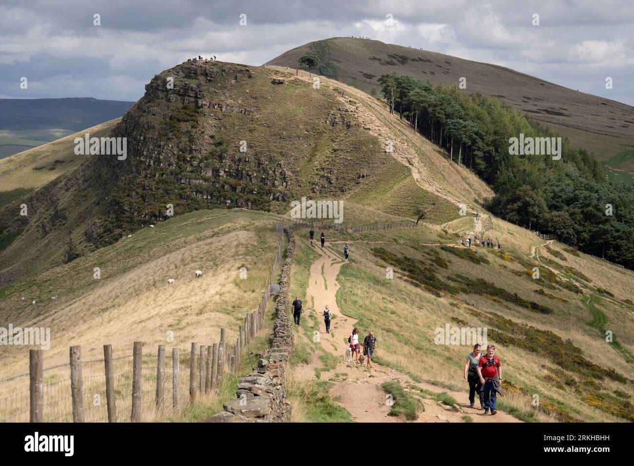 Family walkers and long-distance hikers take the footpath along the ...