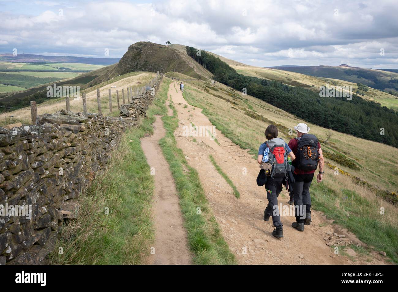 Family walkers and long-distance hikers take the footpath along the ...