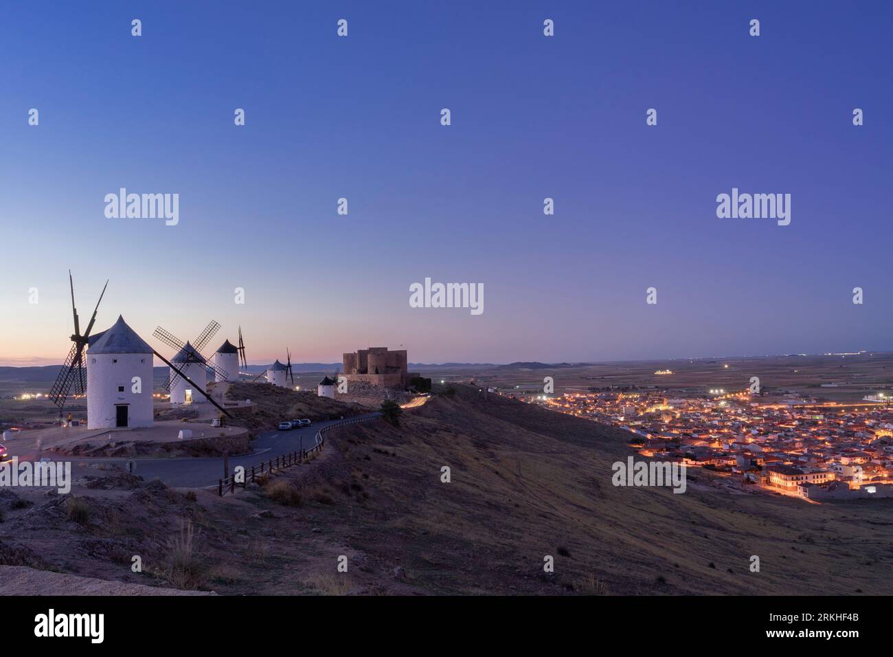 Nightfall between windmills and the medieval village of Consuegra ...