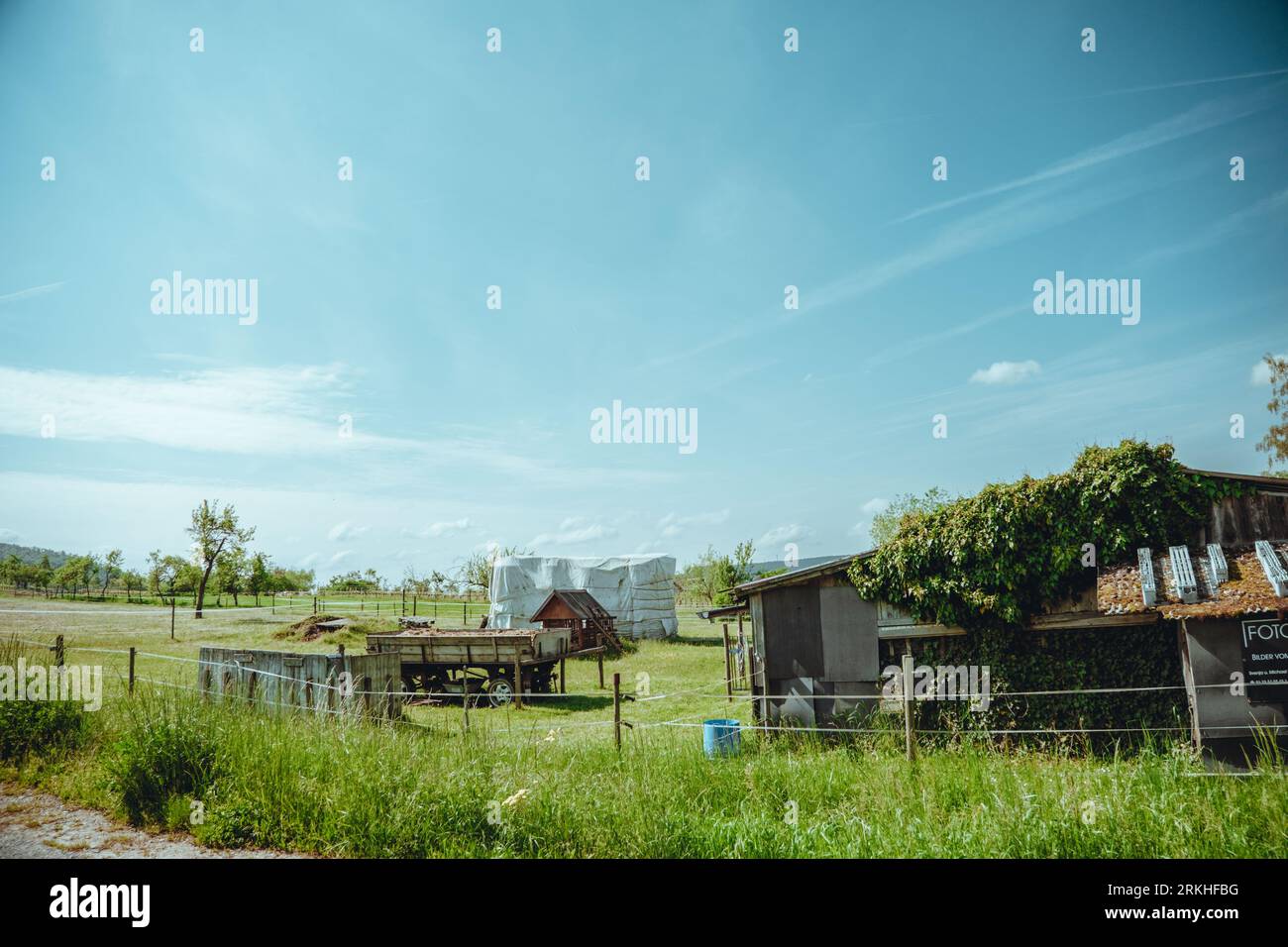 This is a scenic image of an old abandoned shack situated in the rural ...