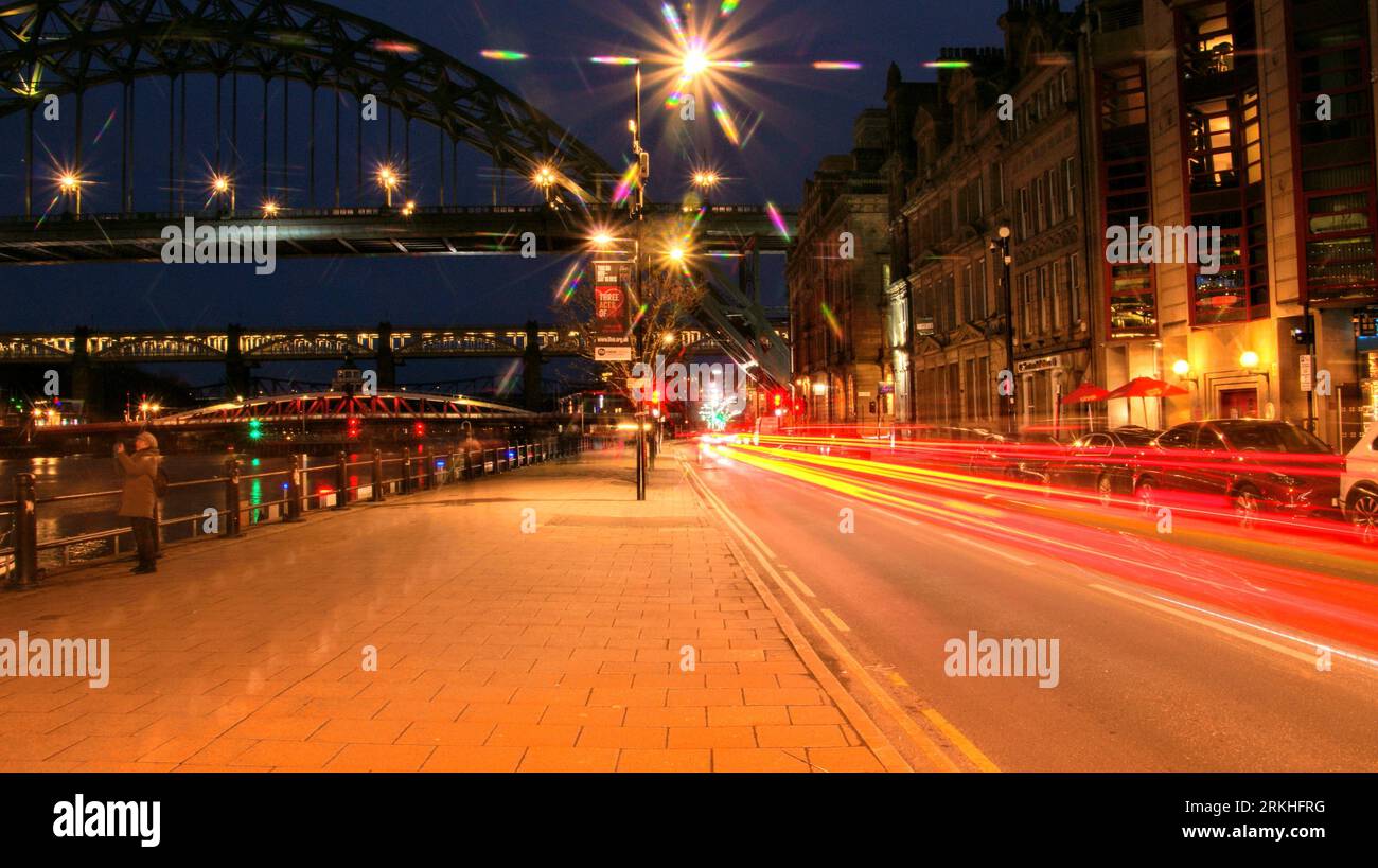 An illuminated nighttime view of Newcastle Quayside featuring vibrant ...