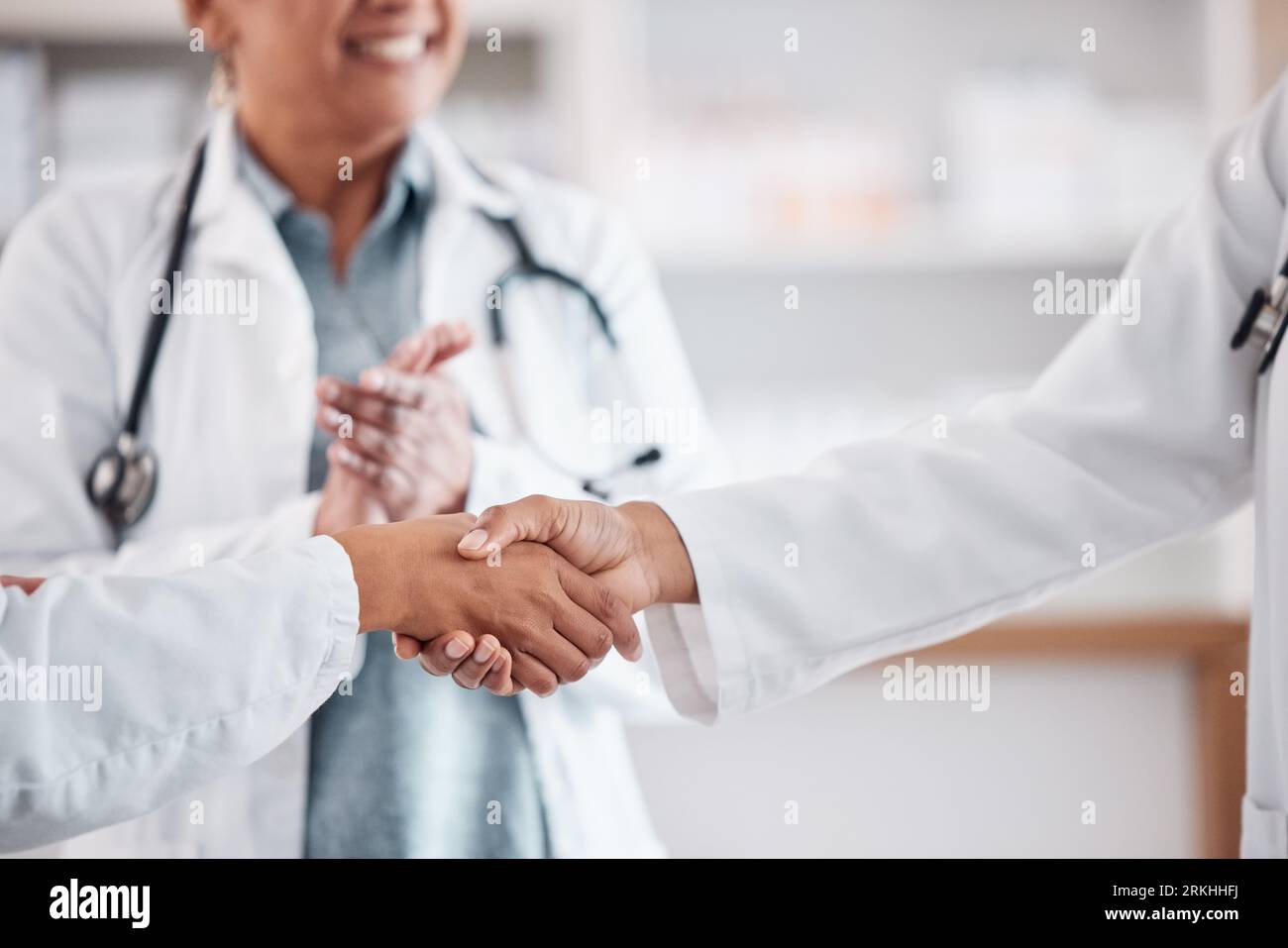 Clapping, teamwork or doctors shaking hands for success, good job or promotion goal in a ...