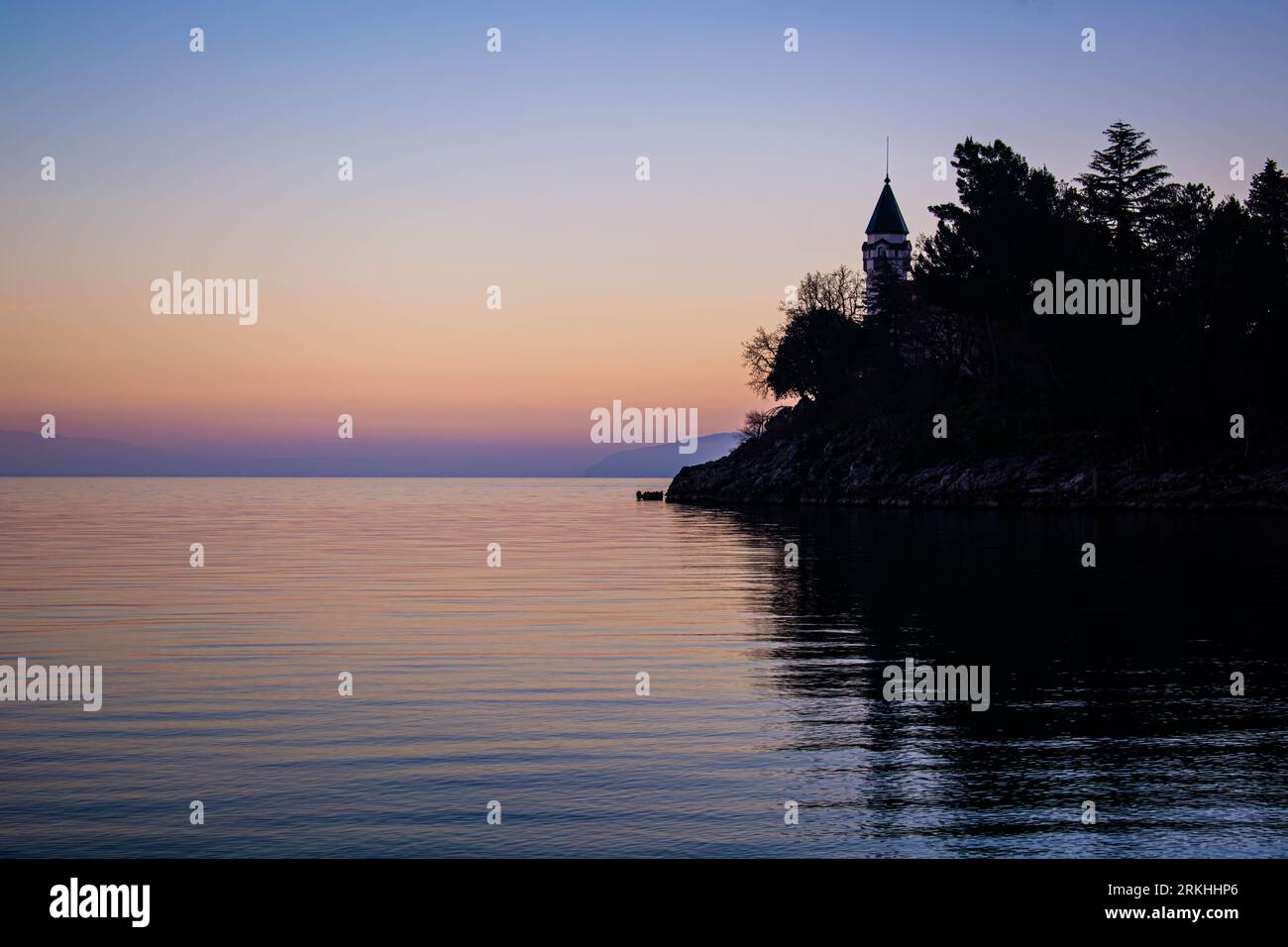 A tranquil scene of a peaceful lake surrounded by lush trees in a ...