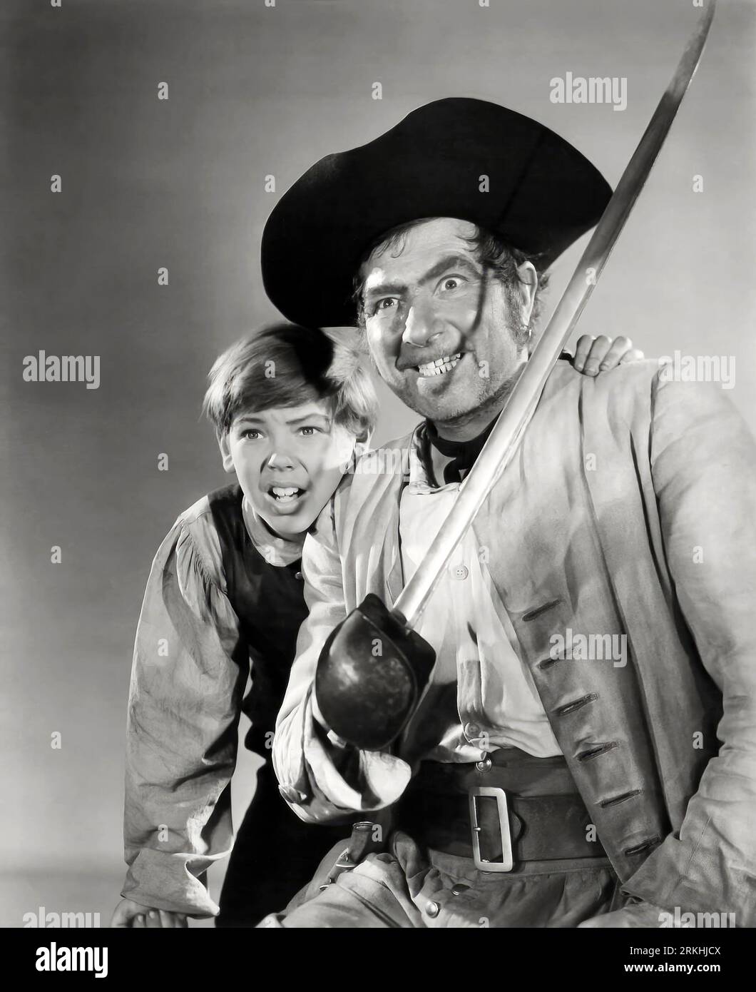 BOBBY DRISCOLL and ROBERT NEWTON in TREASURE ISLAND (1950), directed by ...