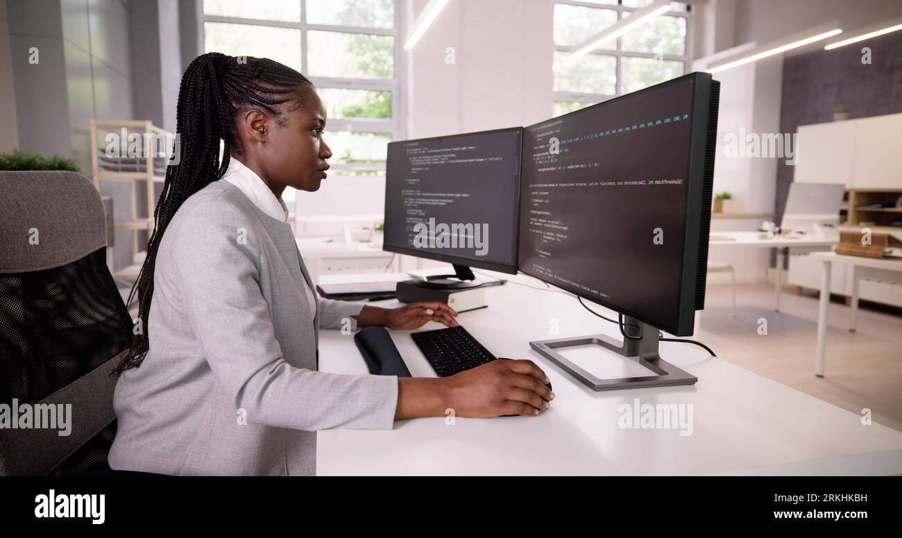 African American Coder Using Computer At Desk. Web Developer Lady Stock Photo - Alamy