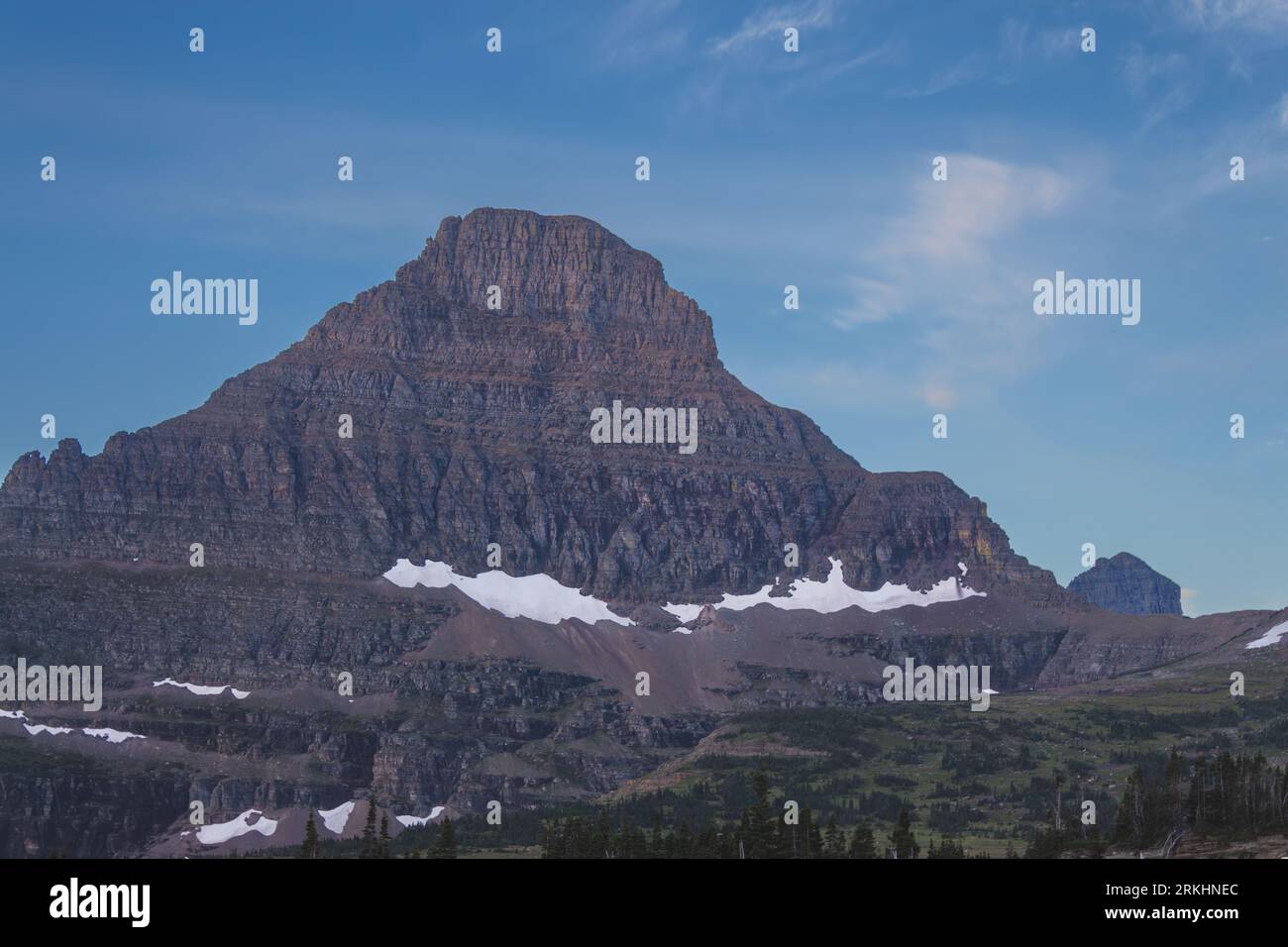 An awe-inspiring landscape featuring towering snow-capped mountains in ...