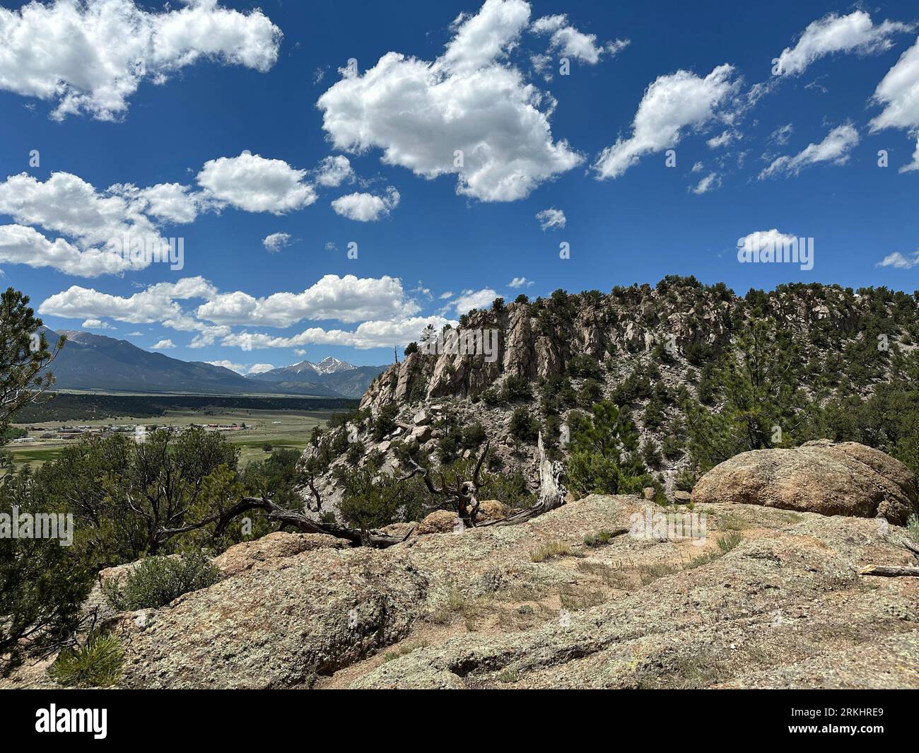 A scenic view of a valley featuring rolling mountains in the distance ...