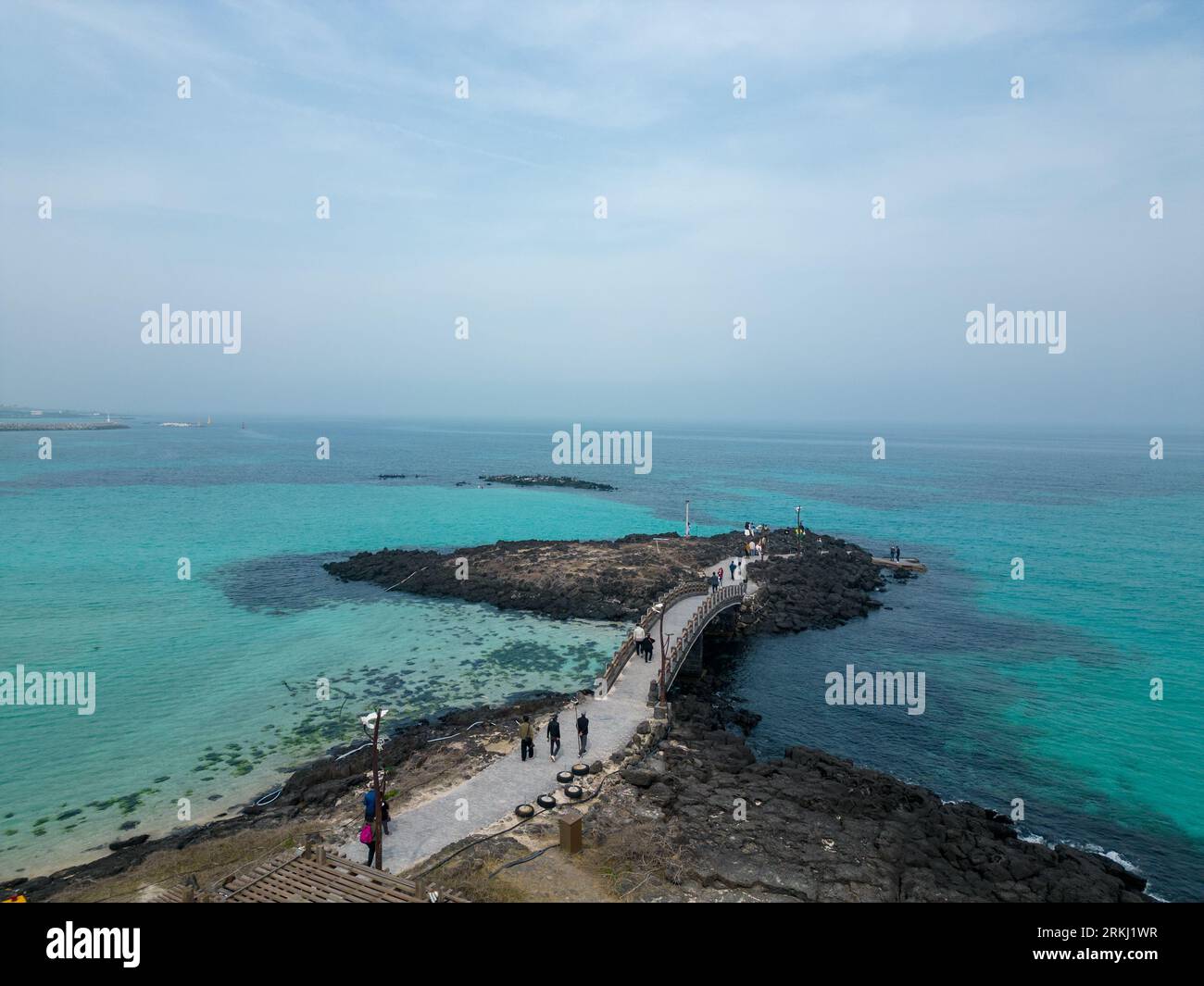 The tranquil waters and towering cliffs beyond South Korea, Jeju in ...
