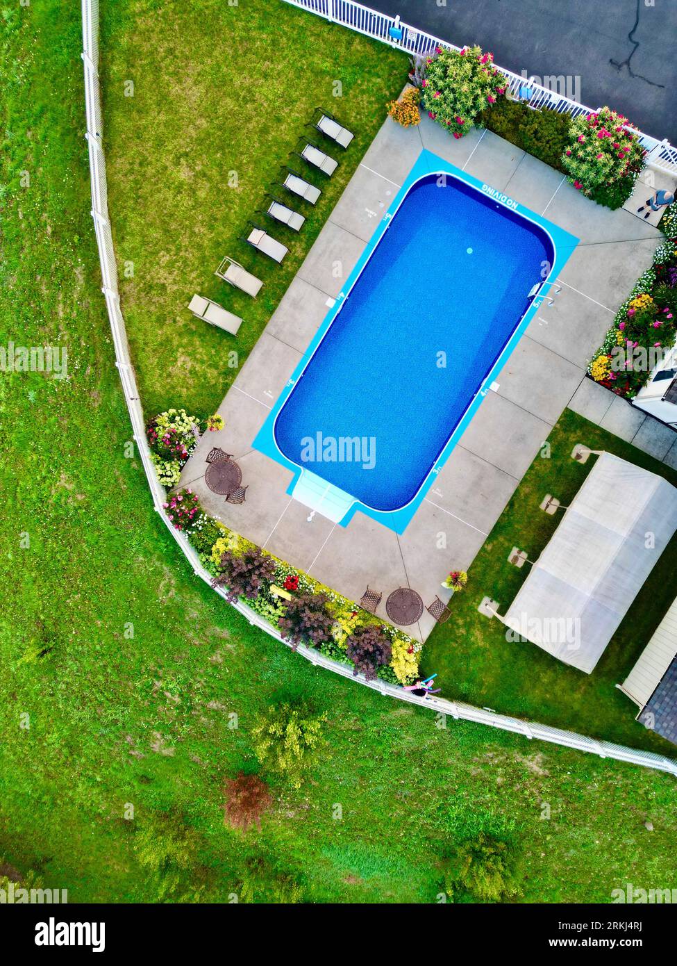 An aerial view of a residential backyard with a large rectangular ...