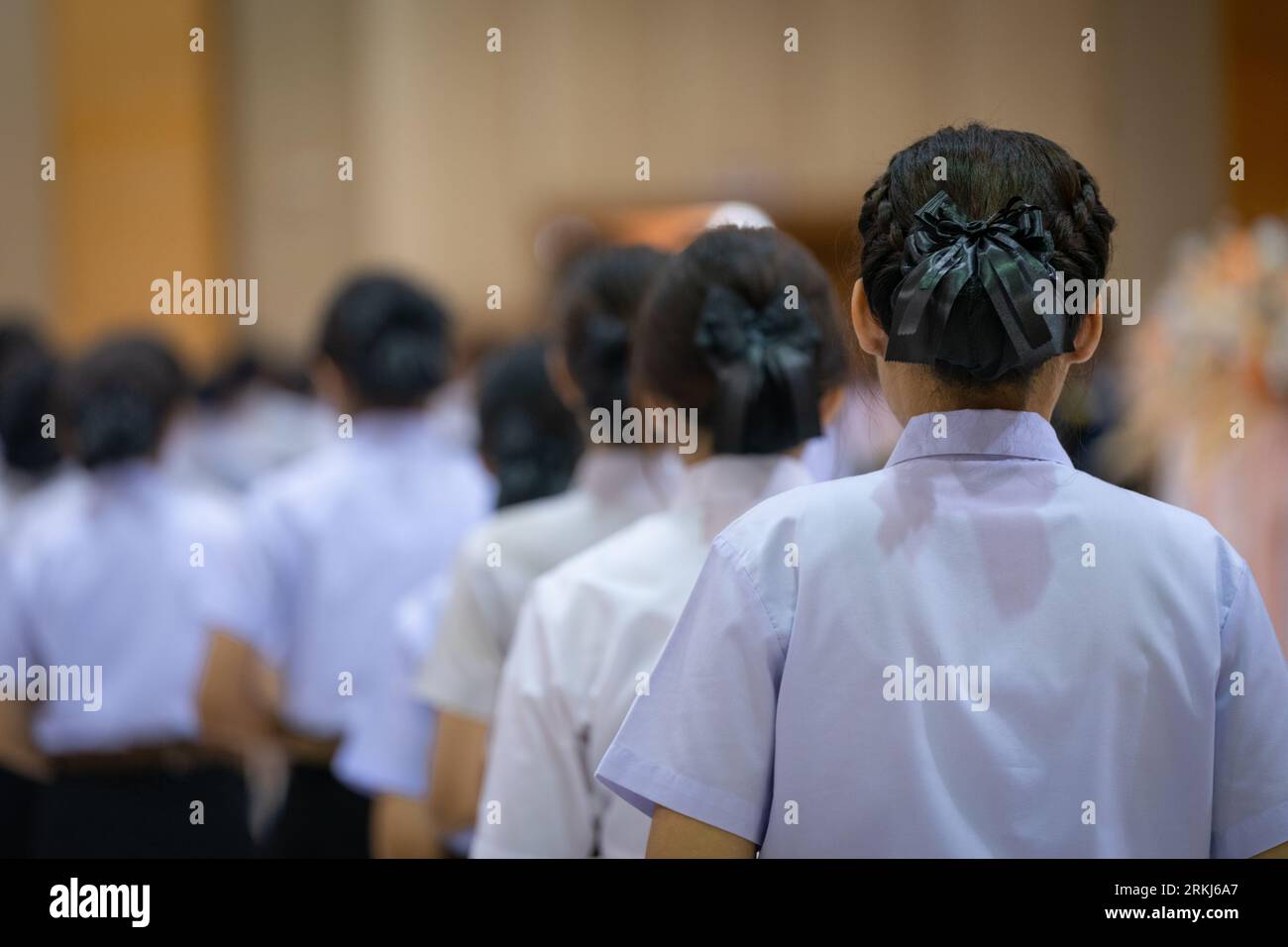 A closeup of a group of school-aged students wearing their school ...